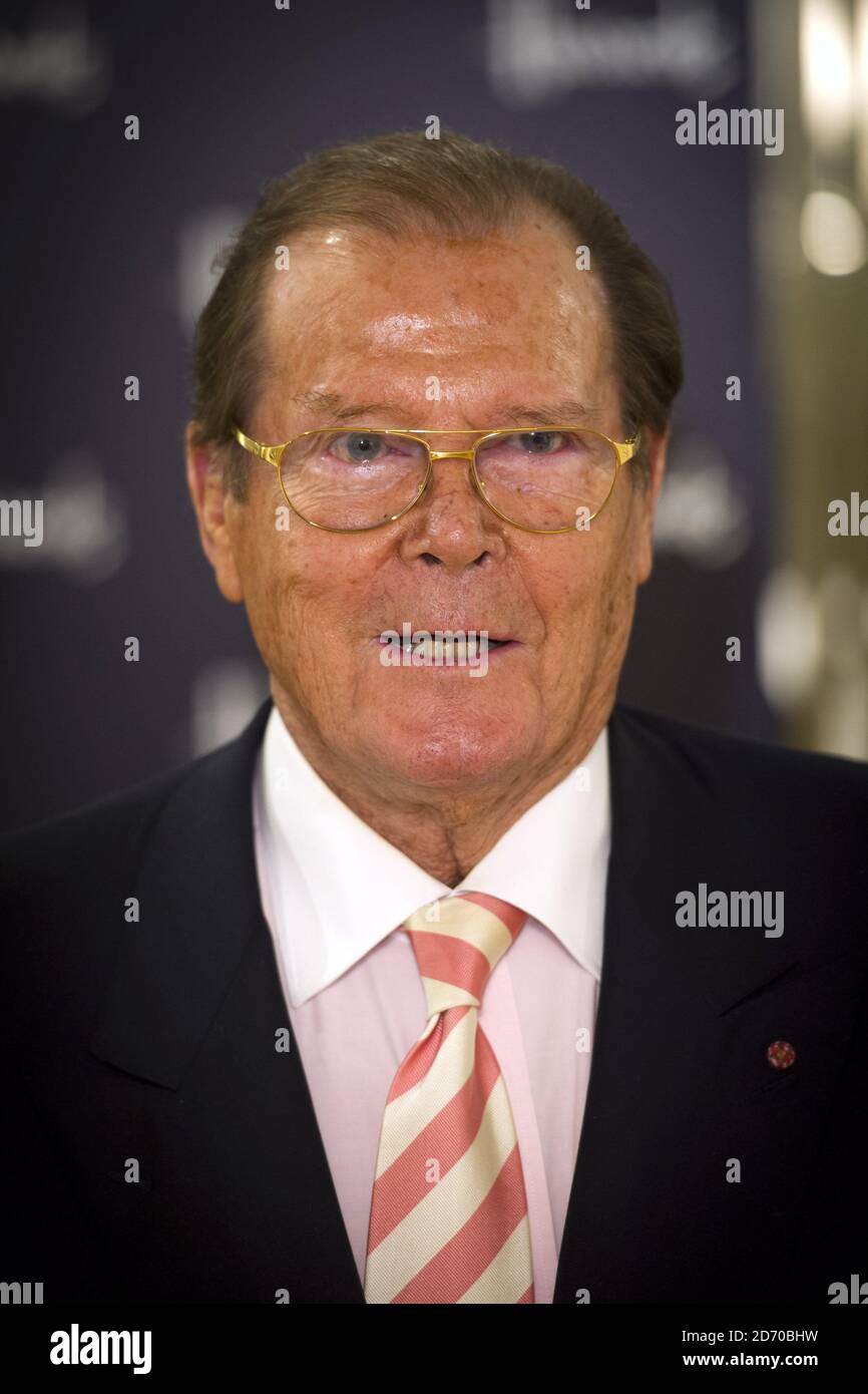Roger Moore signs copies of his book, Bond on Bond, at Harrod's in West ...