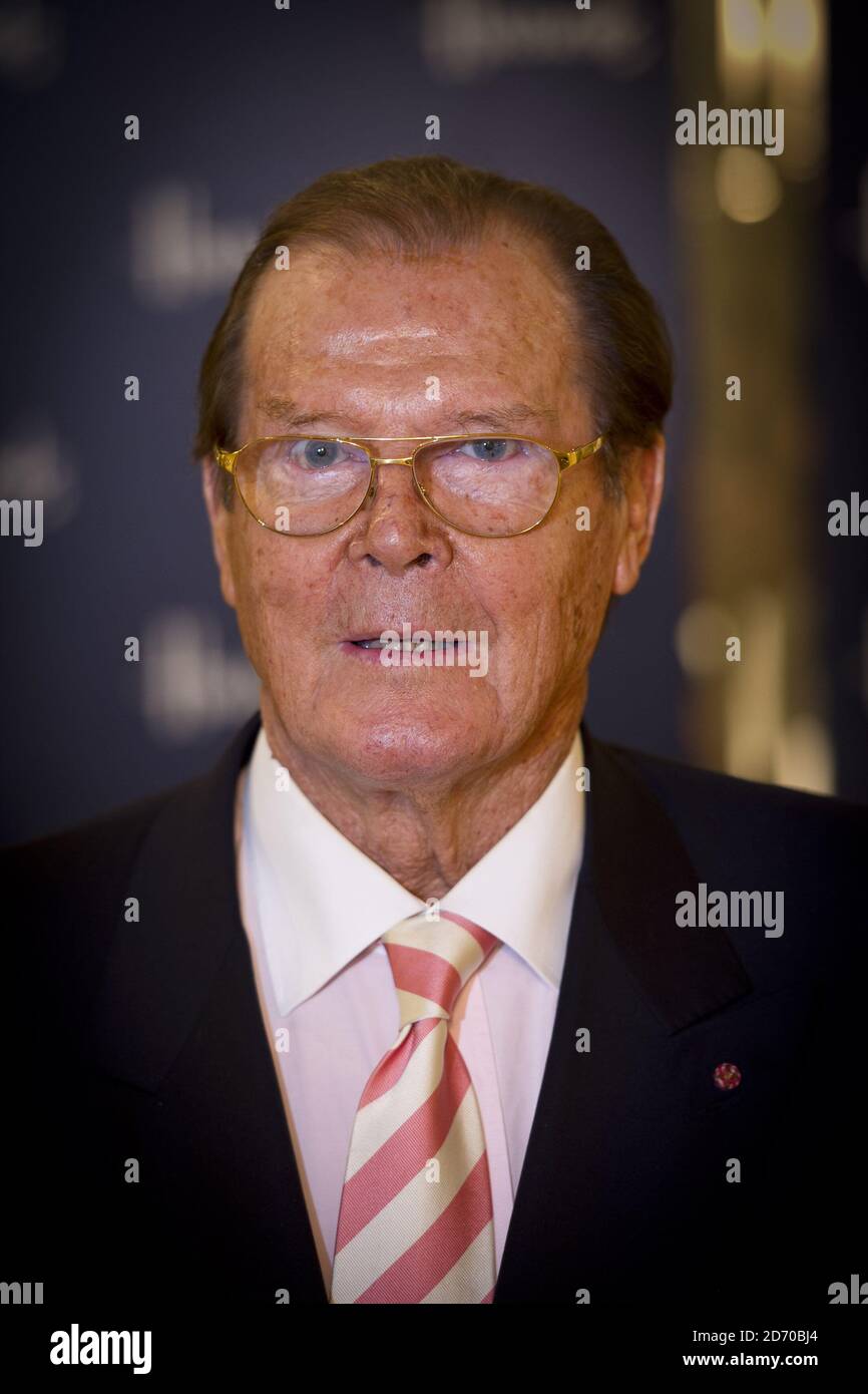 Roger Moore signs copies of his book, Bond on Bond, at Harrod's in West ...