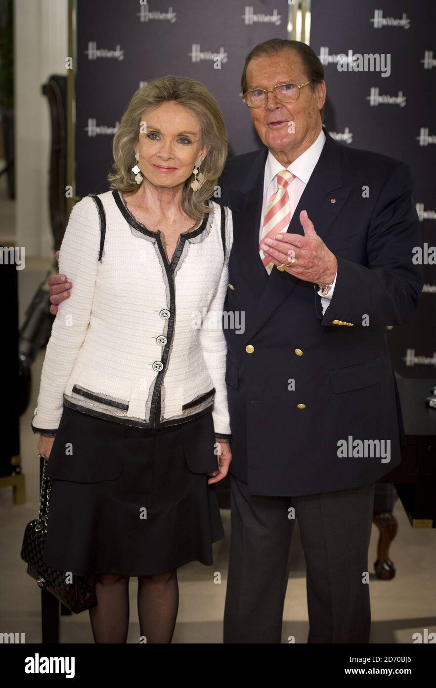 Roger Moore signs copies of his book, Bond on Bond, at Harrod's in West ...