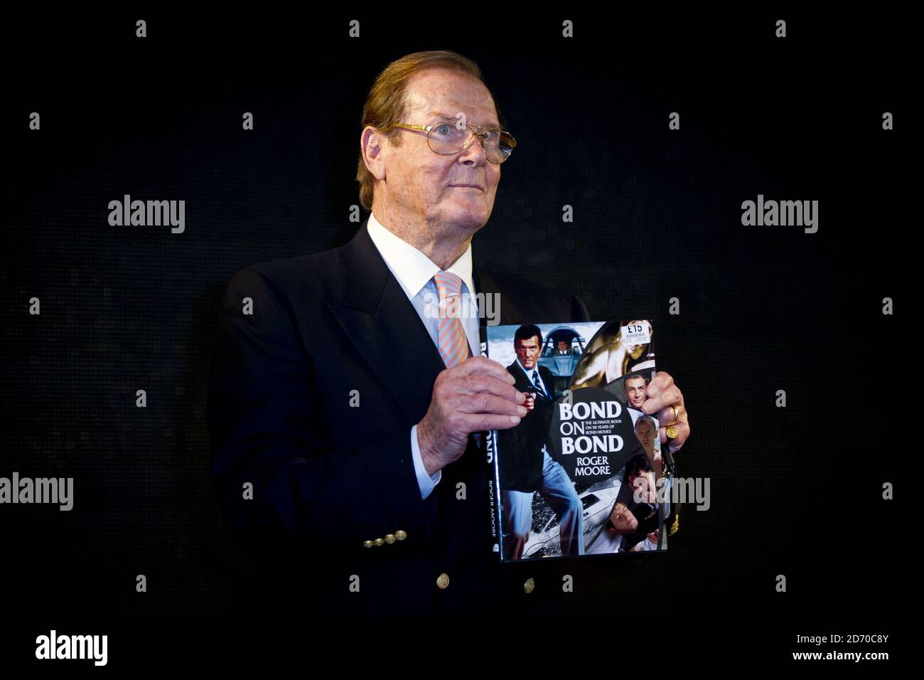 Roger Moore signs copies of his book, Bond on Bond, in HMV in central ...