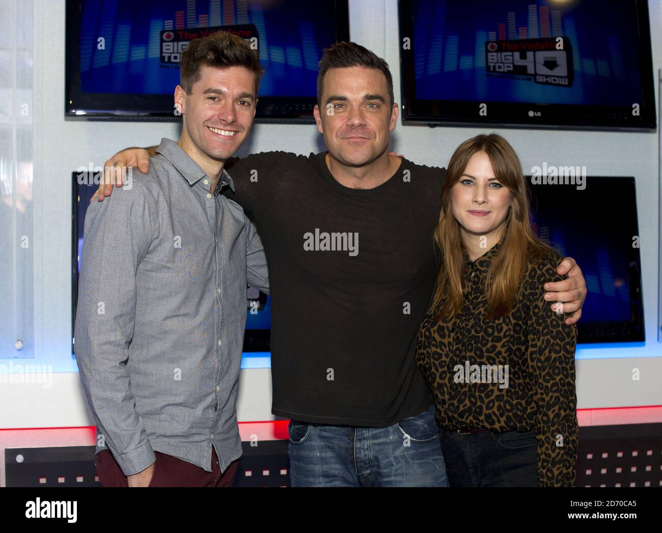 Robbie Williams pictured with Big Top 40 presenters Rich Clarke and Kat ...