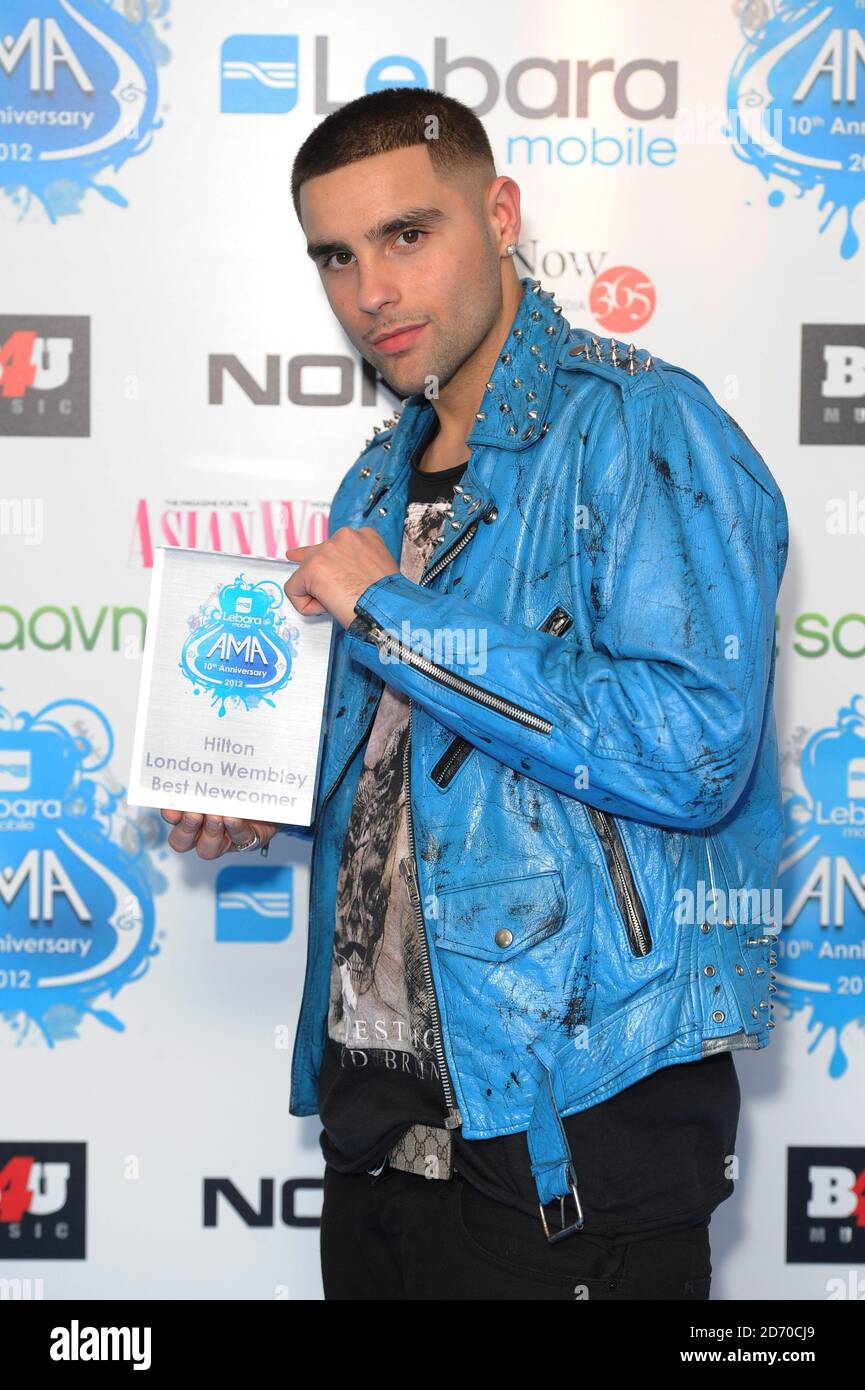 Shide Boss pictured with the best newcomer award, at the 2012 Asian ...