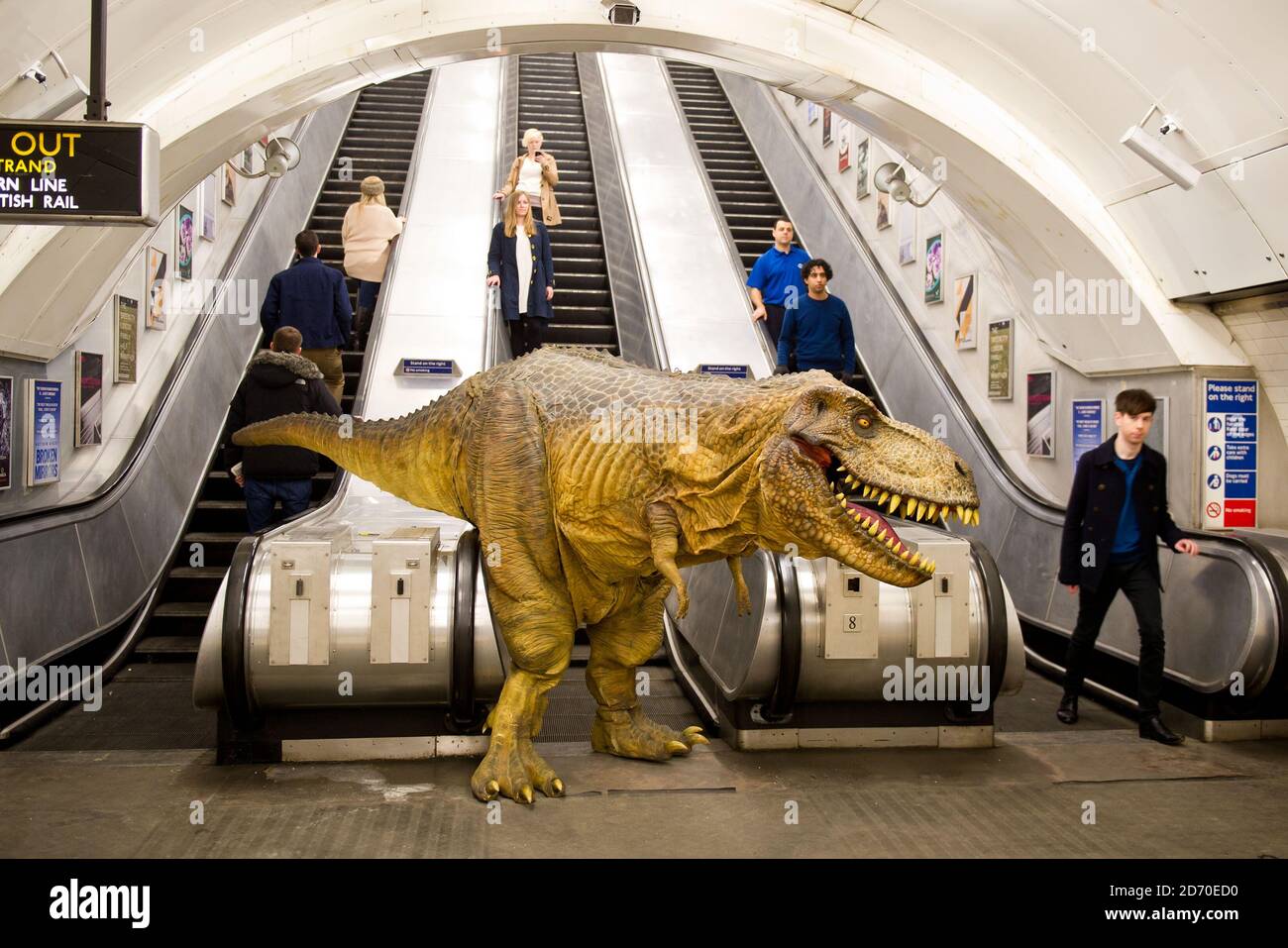 A T-Rex joins London commuters at Charing Cross Station during their ...