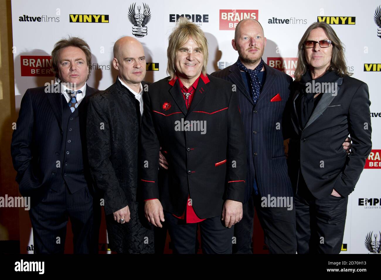 Mike Peters (centre) and The Alarm attending a gala screening of Vinyl ...