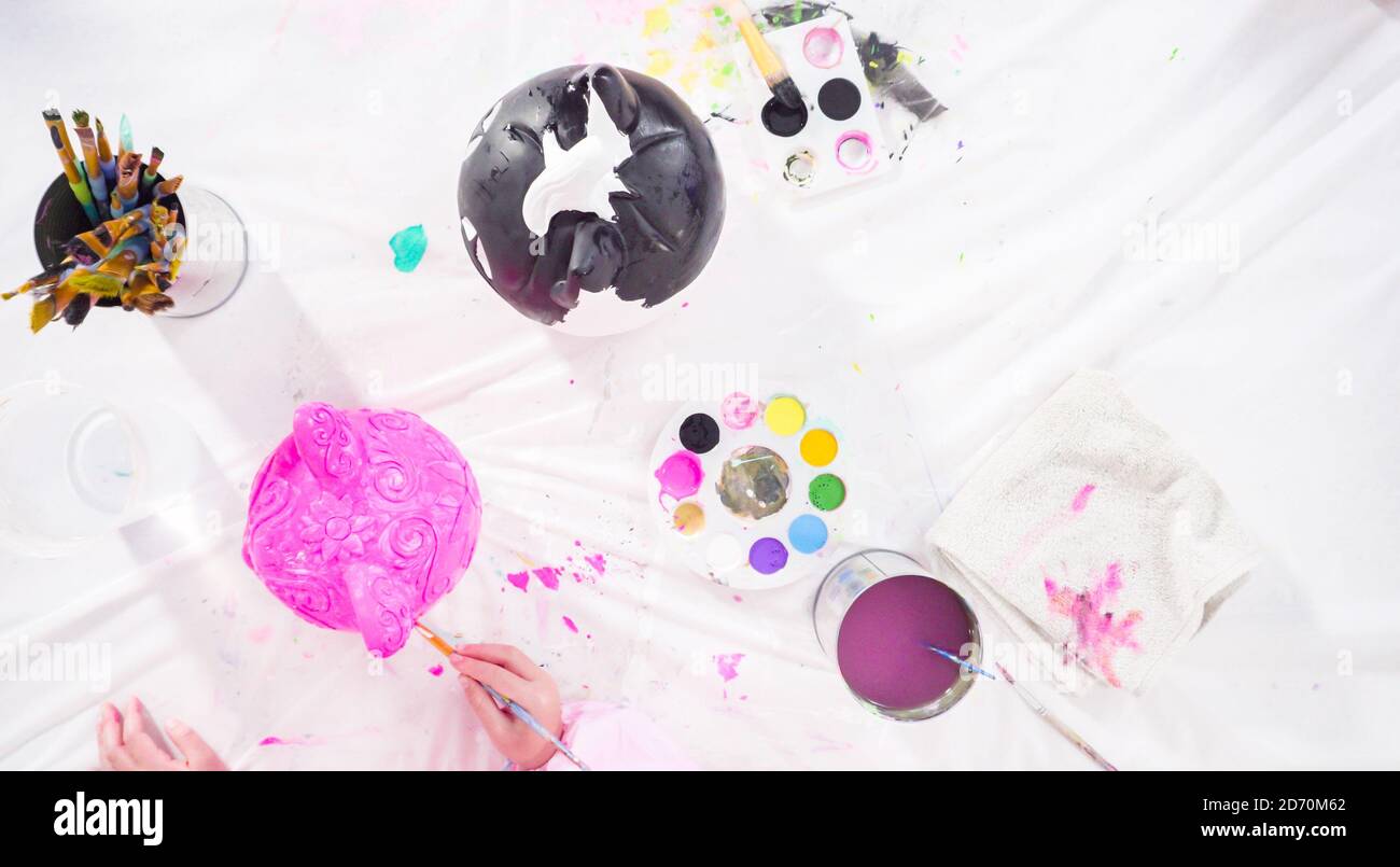 Flat lay. Painting craft pumpkin with acrylic paint for Halloween Stock ...