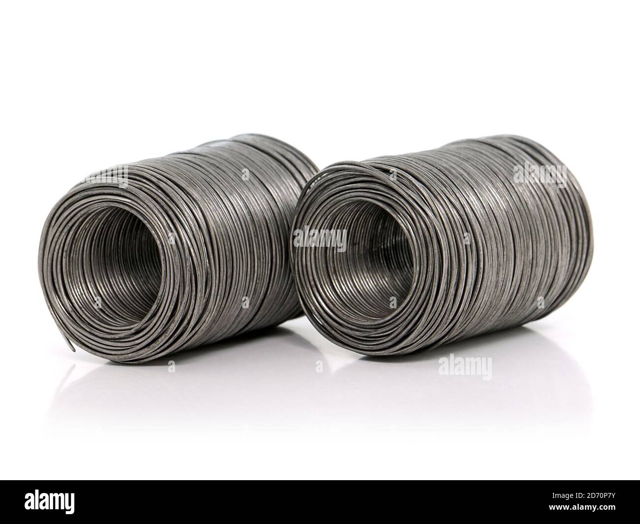 Roll of metal wire isolated on white Stock Photo - Alamy