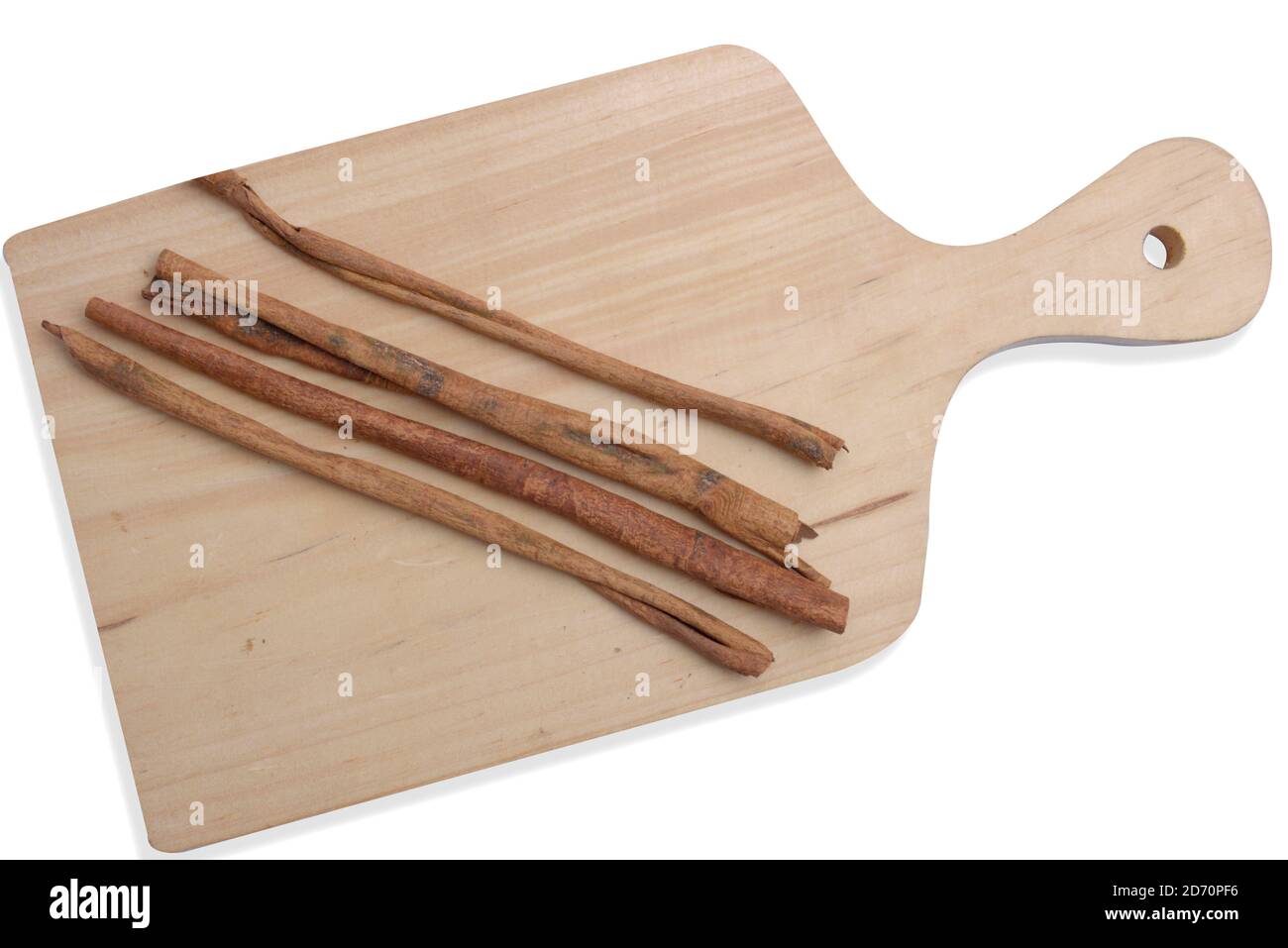 Cinnamon sticks on cutting board isolated over white background Stock ...