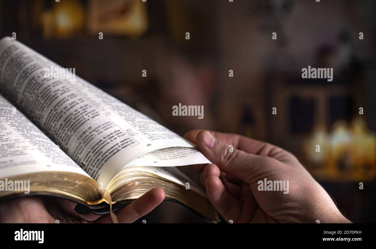 Mans hands over bible hi-res stock photography and images - Alamy