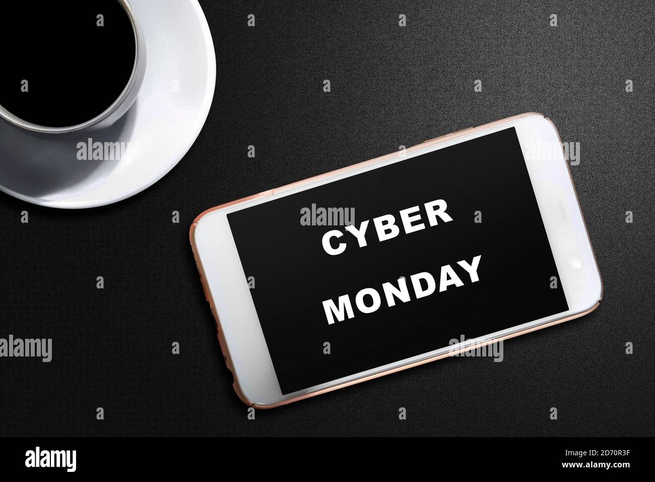 Cyber Monday text on the mobile phone screen with a black background ...