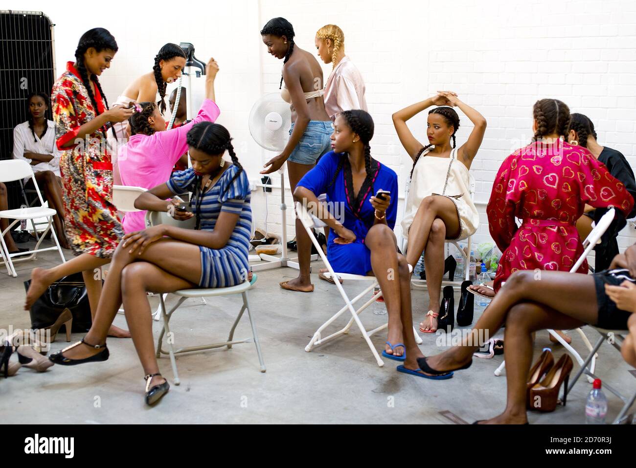 Models prepare backstage at African Fashion Week London, a 3-day event ...