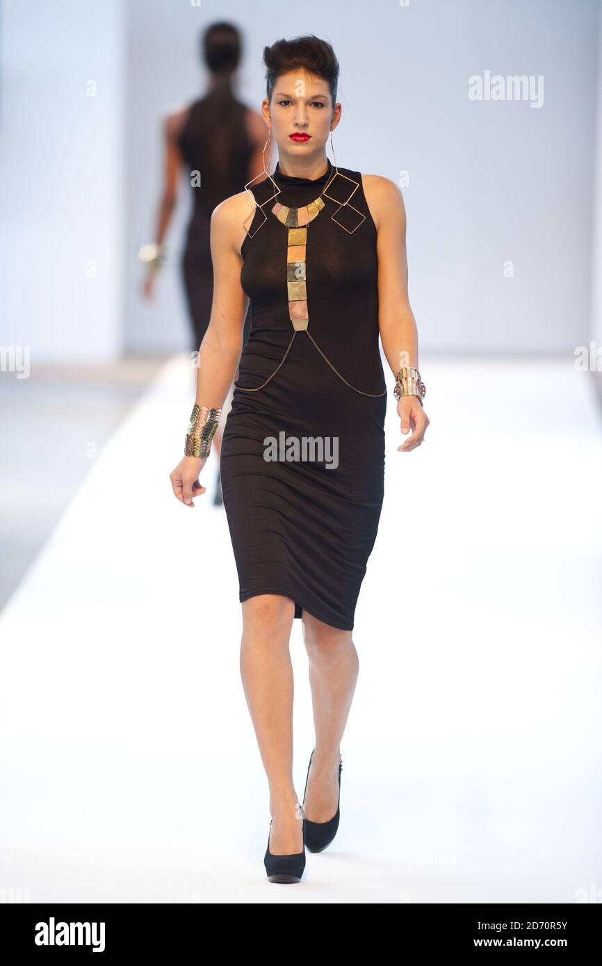 A model wears a design by Rya-V Jewellery at African Fashion Week ...