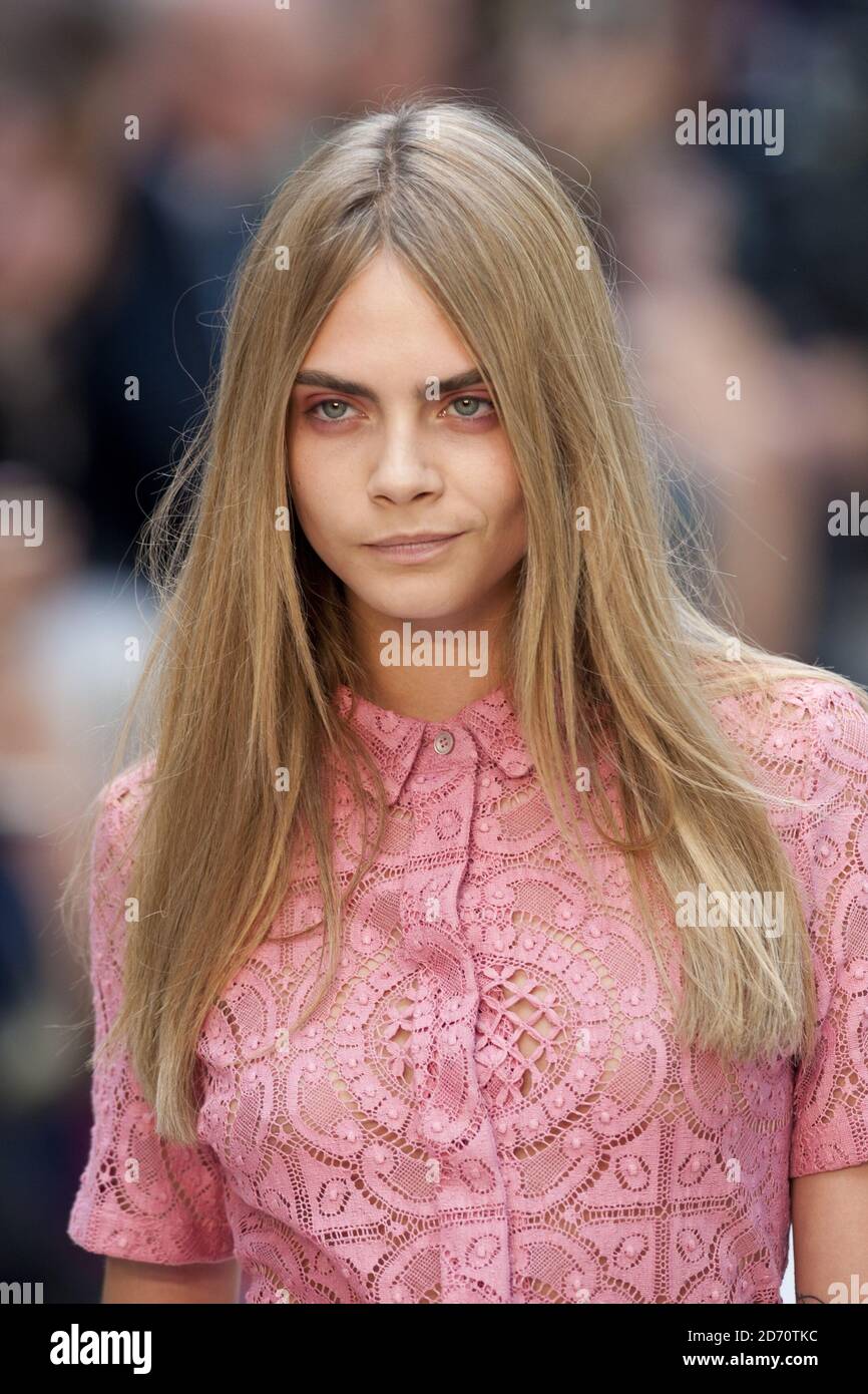Model Cara Delevingne on the catwalk at the Burberry fashion show, held ...