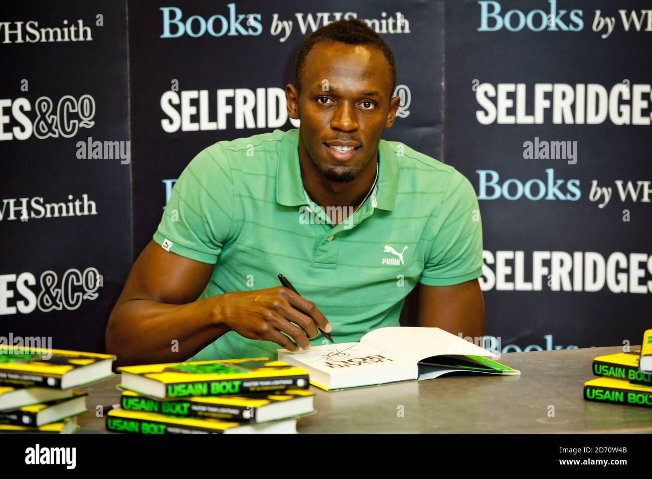 Usain Bolt pictured at Selfridge's in London, as he signs copies of his ...