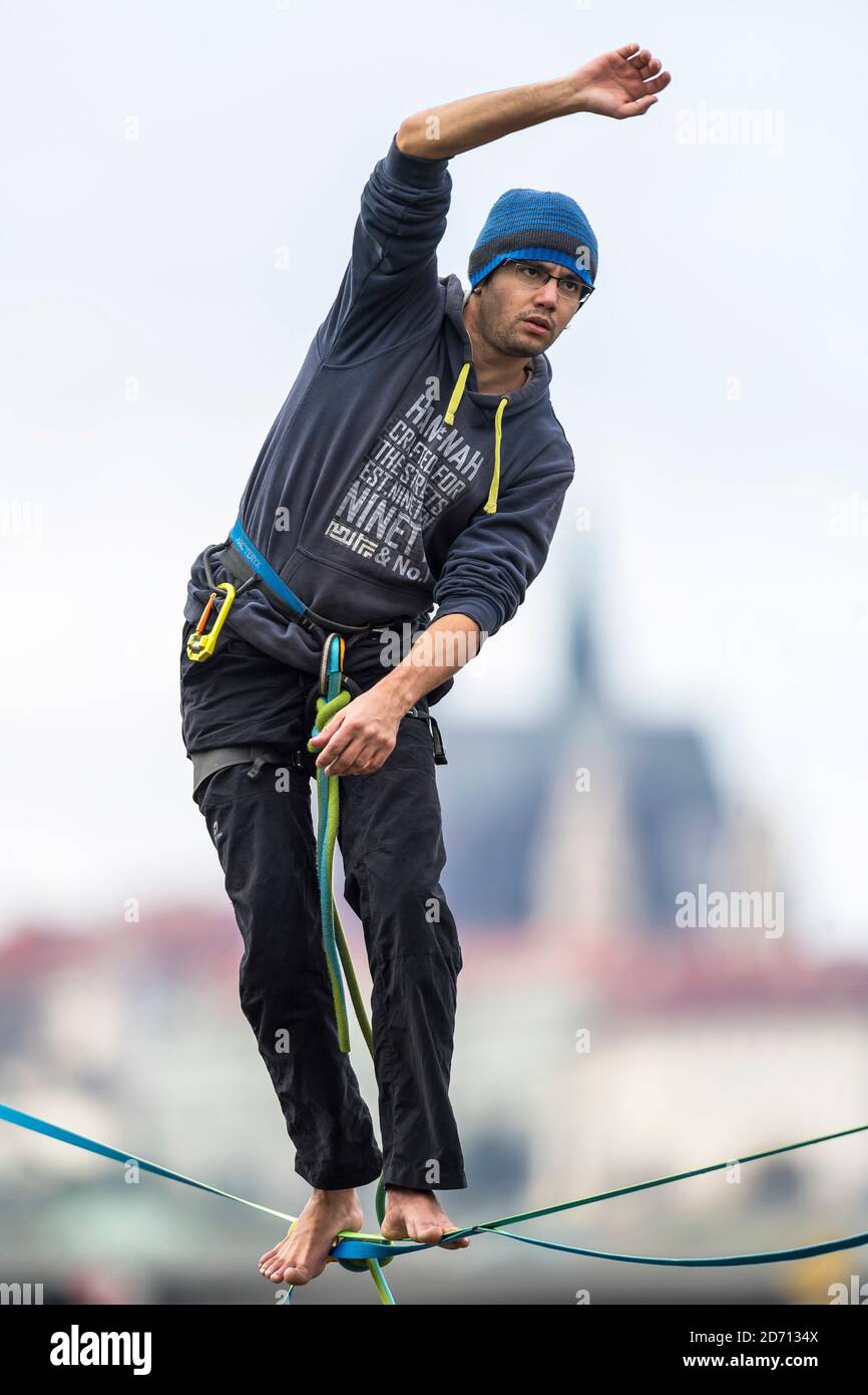 Balancing along a suspended length of flat webbing hi-res stock ...