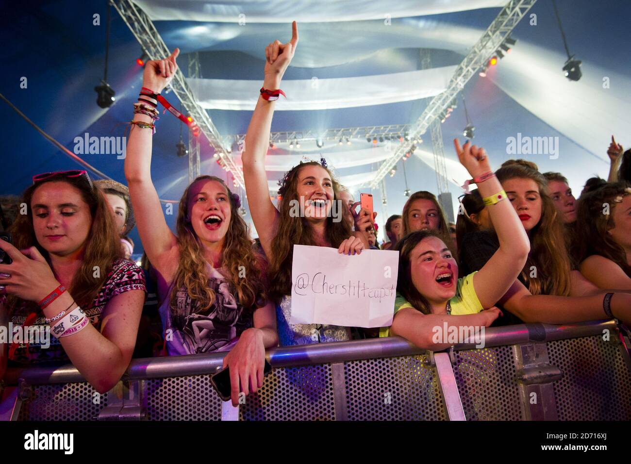 The crowd watch Cher Lloyd performing at the Isle of Wight Festival, at ...