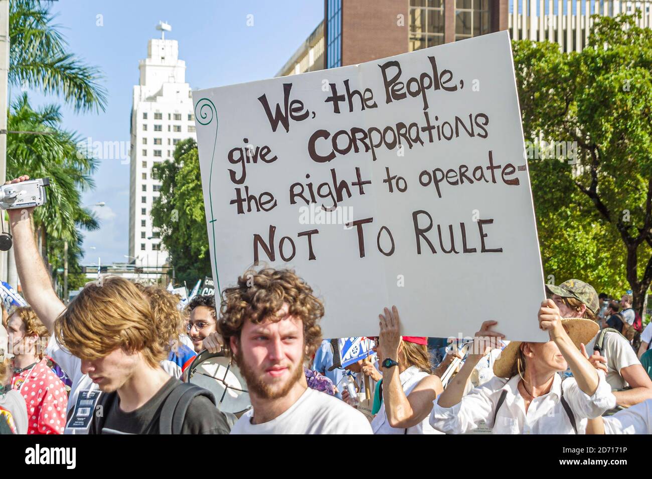 Protesters holds holding sign poster corporate greed hi-res stock ...