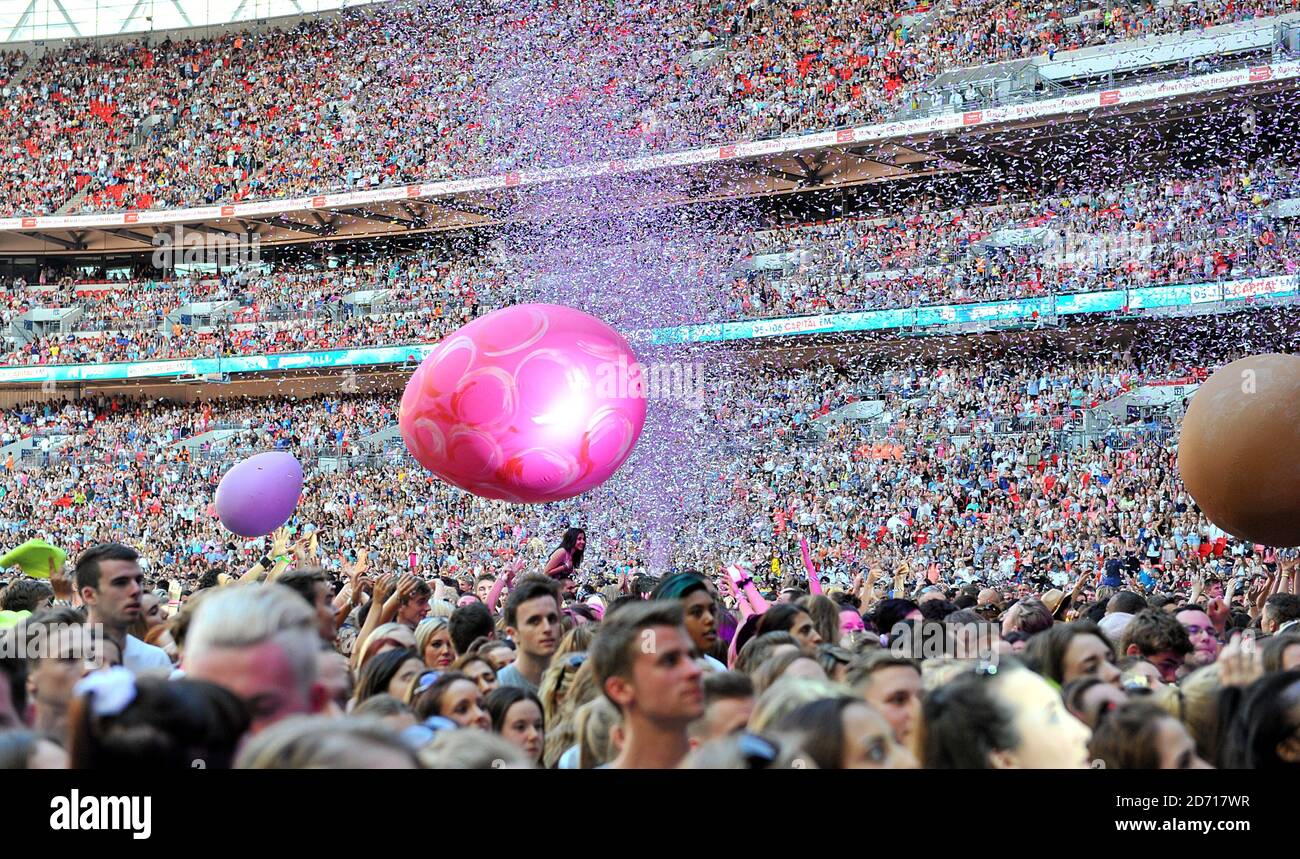 Giant inflatable balloons are passed around the crowd during Capital FM ...