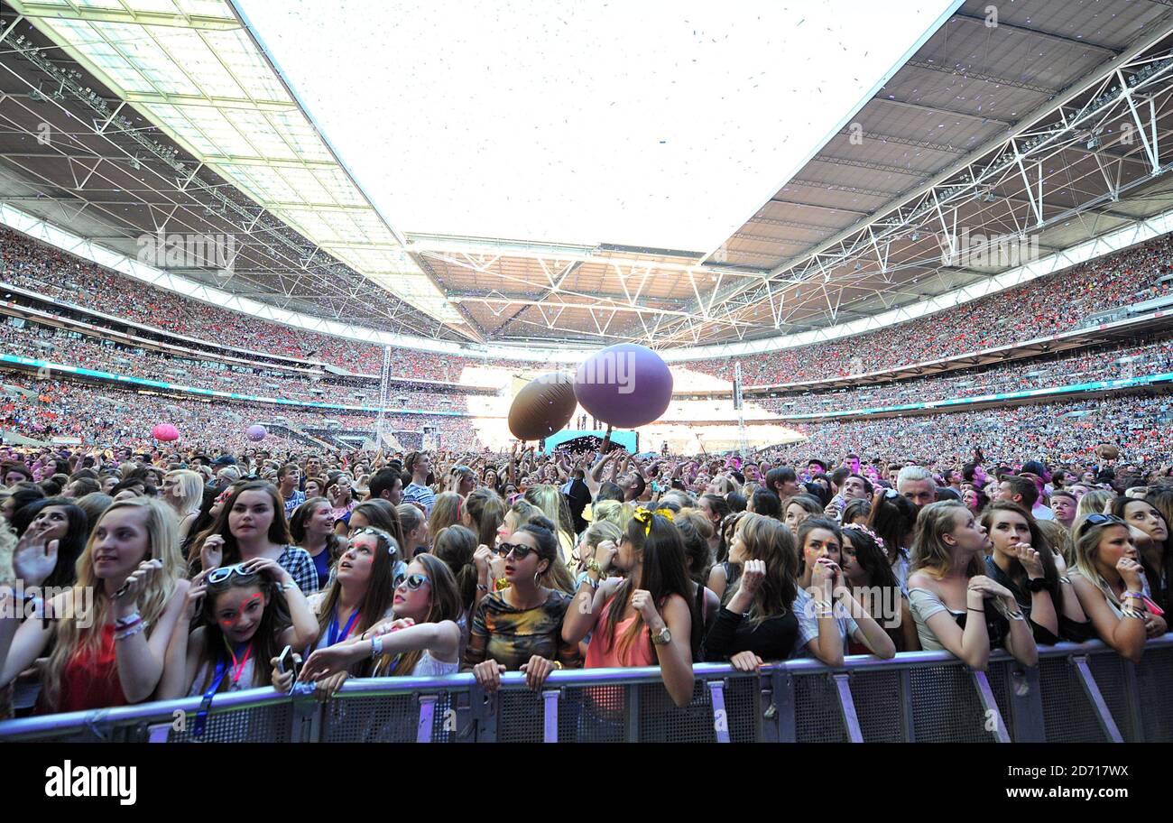 Giant inflatable balloons are passed around the crowd during Capital FM ...
