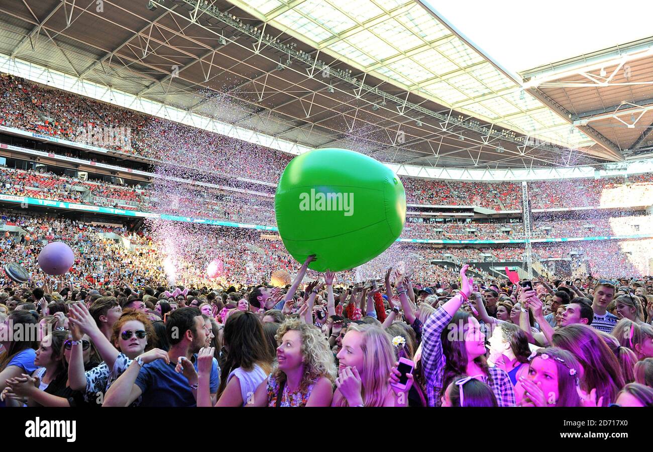 Giant inflatable balloons are passed around the crowd during Capital FM ...