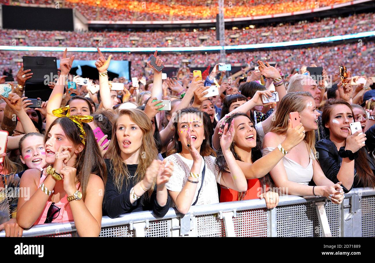 Crowds cheer as Miley Cyrus performs during Capital FM's Summertime ...