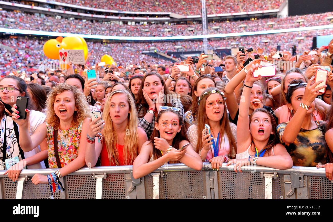 Crowds cheer as Miley Cyrus performs during Capital FM's Summertime ...