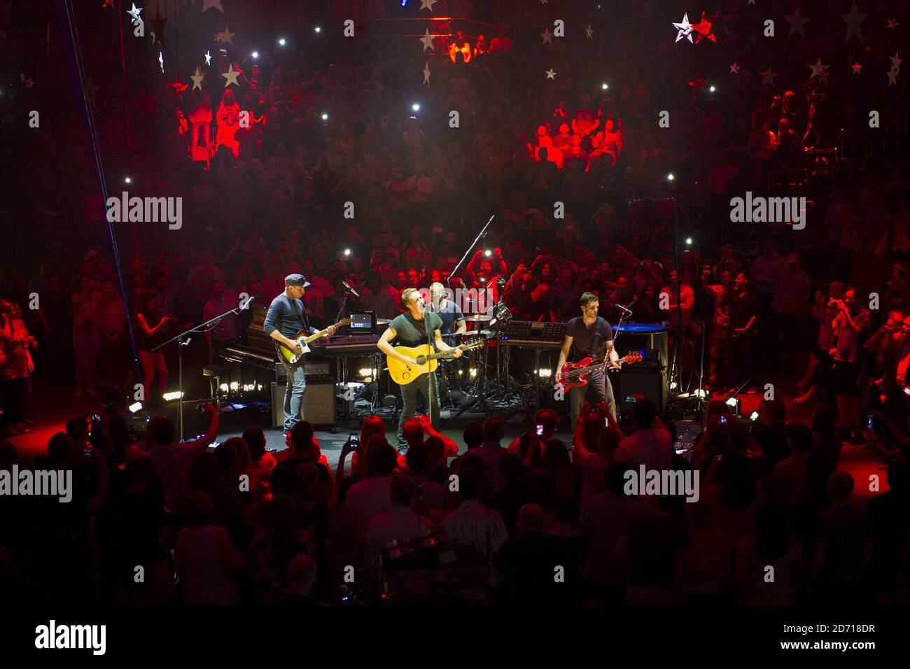 Coldplay performing at the Royal Albert Hall in west London Stock Photo ...