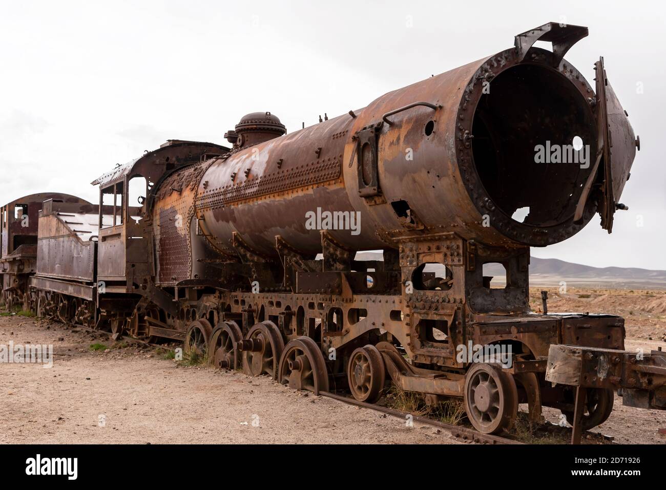 Old rusty locomotive abandoned in a train cemetery. Uyuni, Bolivia ...