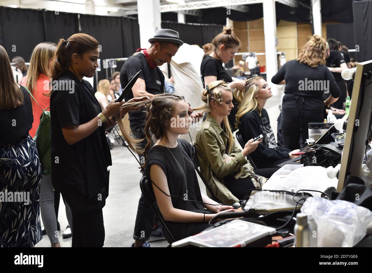 Models prepare backstage for the Nottingham Trent show, during Graduate ...