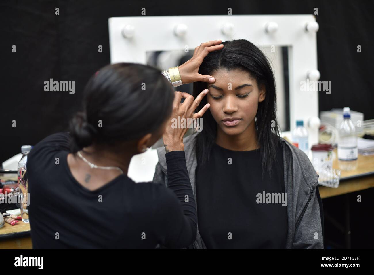 Models prepare backstage for the Nottingham Trent show, during Graduate ...