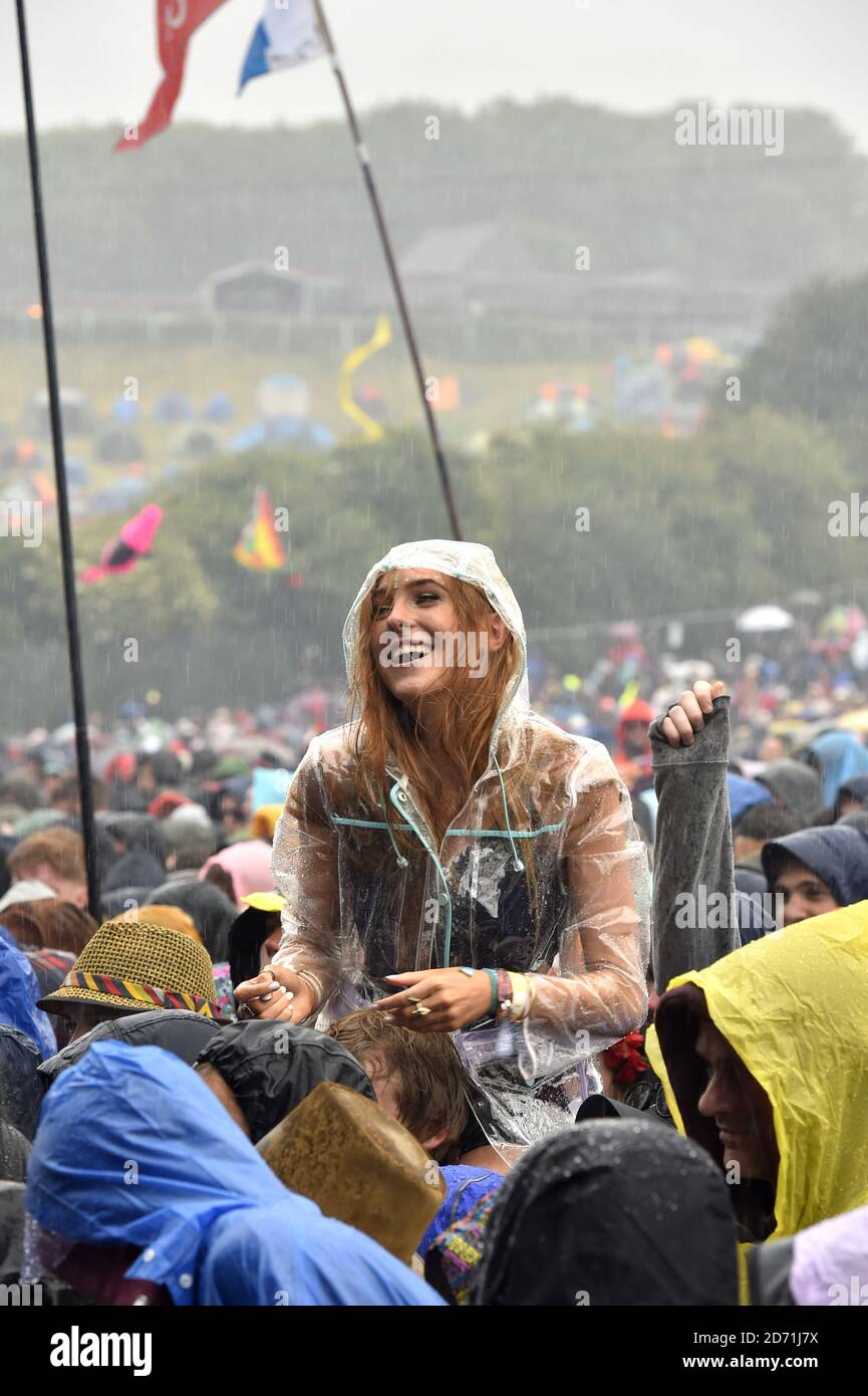 The crowd watch Alabama Shakes performing on the Pyramid Stage, as rain ...