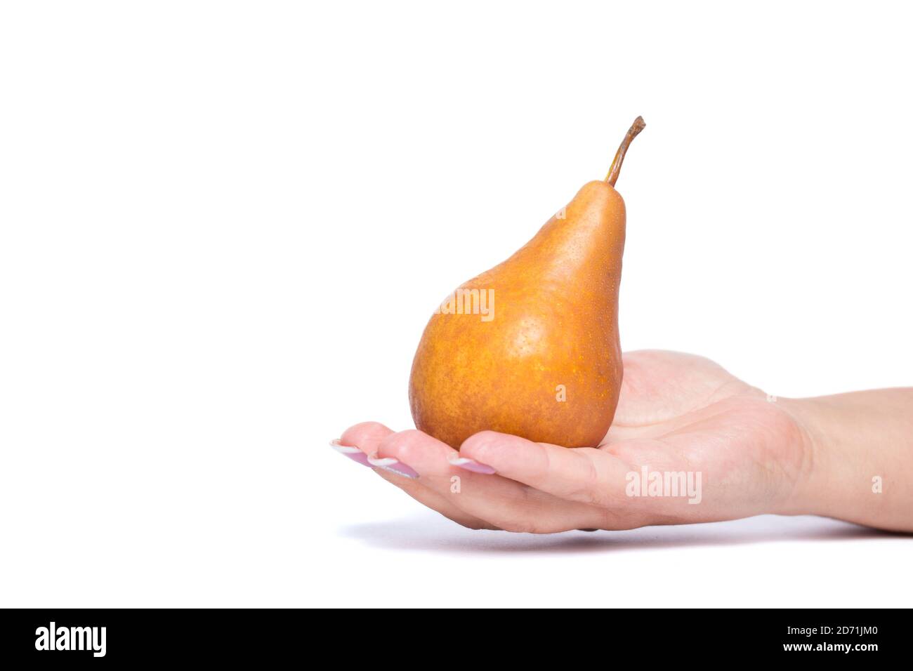 Hand holding pears on green hi-res stock photography and images - Alamy