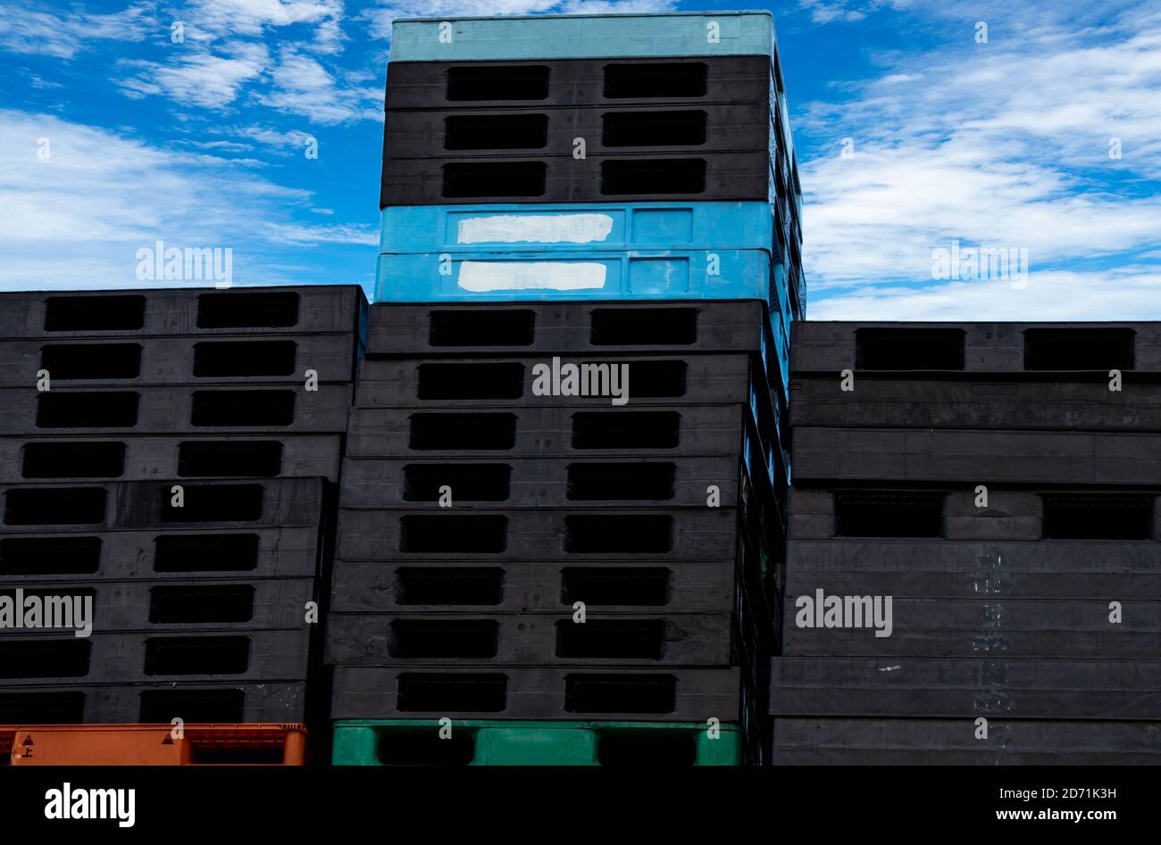 Pile of plastic shipping pallet. Industrial plastic pallet stacked at ...