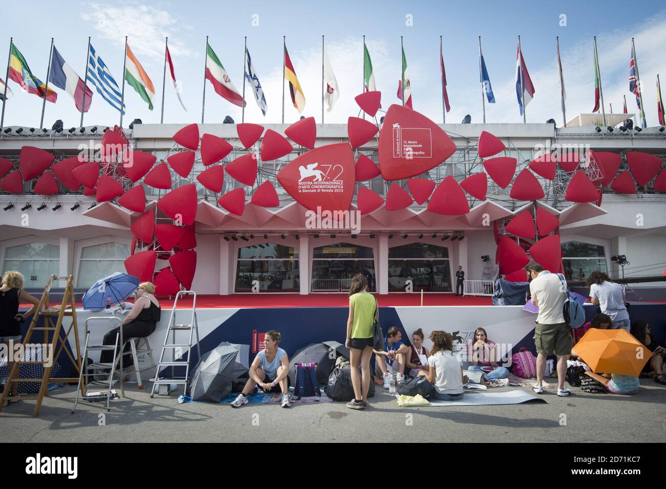 Fans wait alongside the red carpet at the 72nd Venice Film Festival in ...