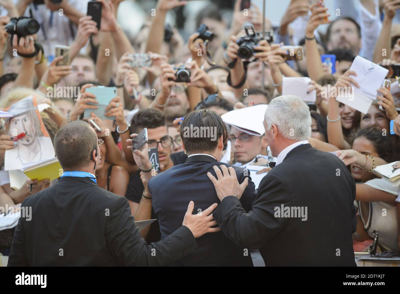 Johnny Depp signs autographs at the Black Mass Premiere, at the 72nd ...