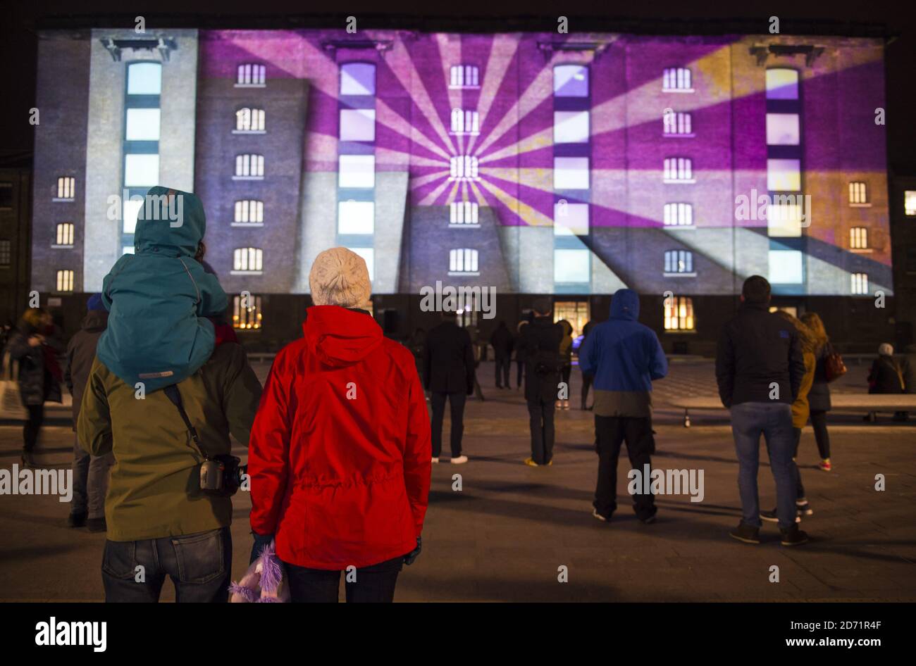 Visitors watch Circus of Light by Ocubo, part of the Lumiere London ...