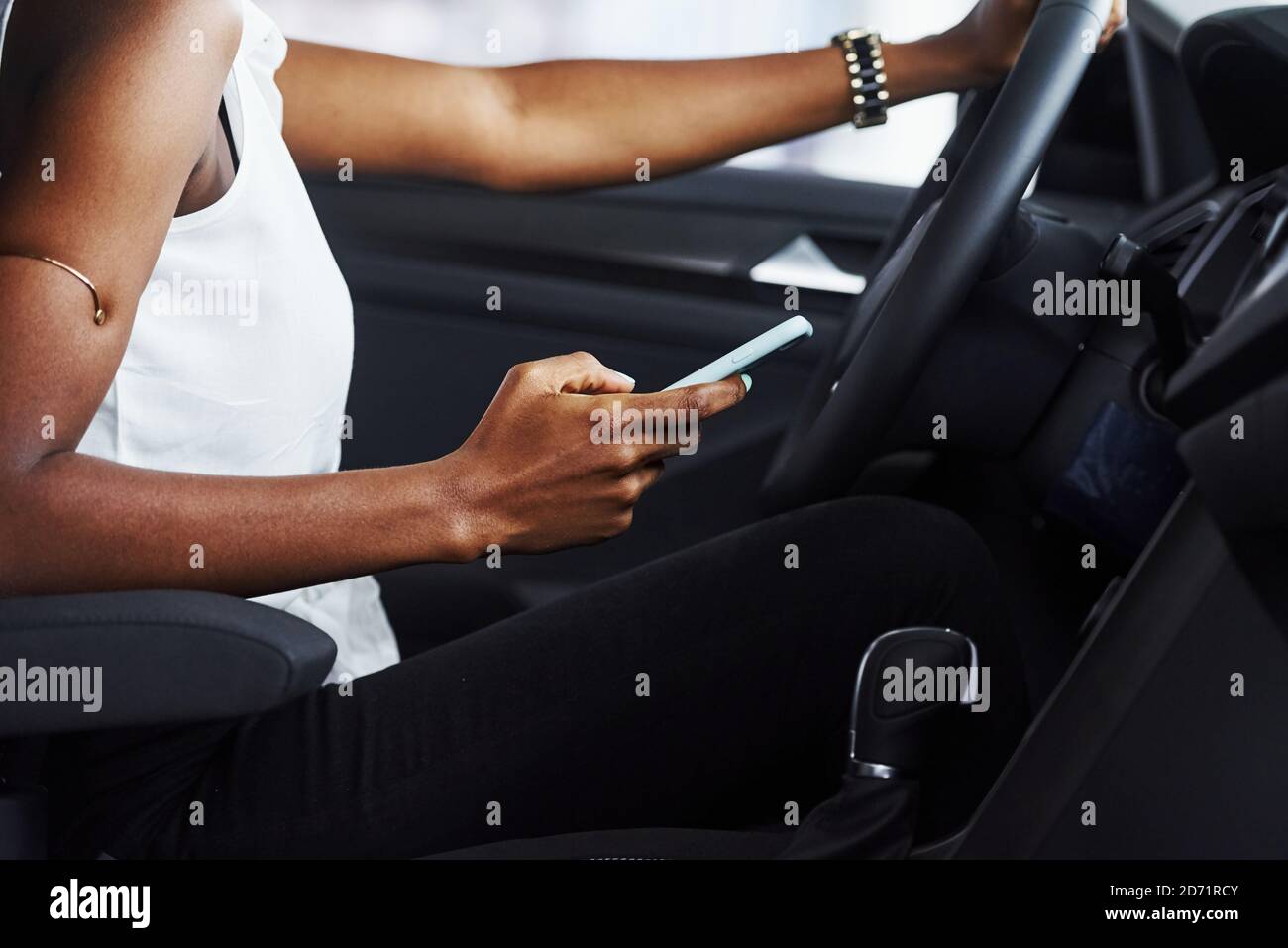 Particle view of young african american woman that sits inside of new ...