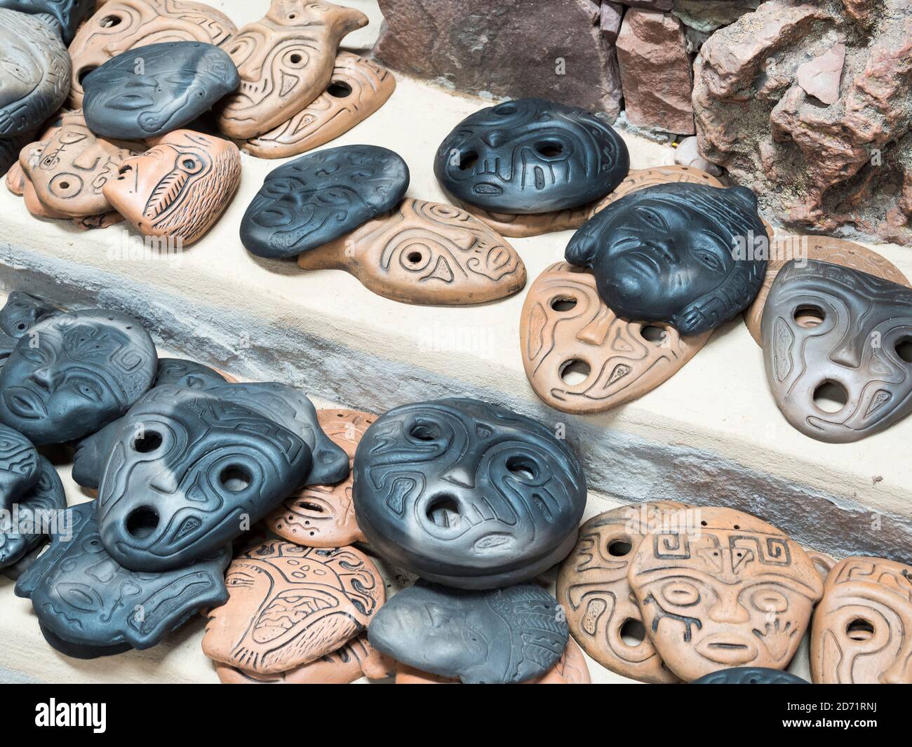Pottery in the canyon Quebrada de Humahuaca, masks in inca syle. The ...