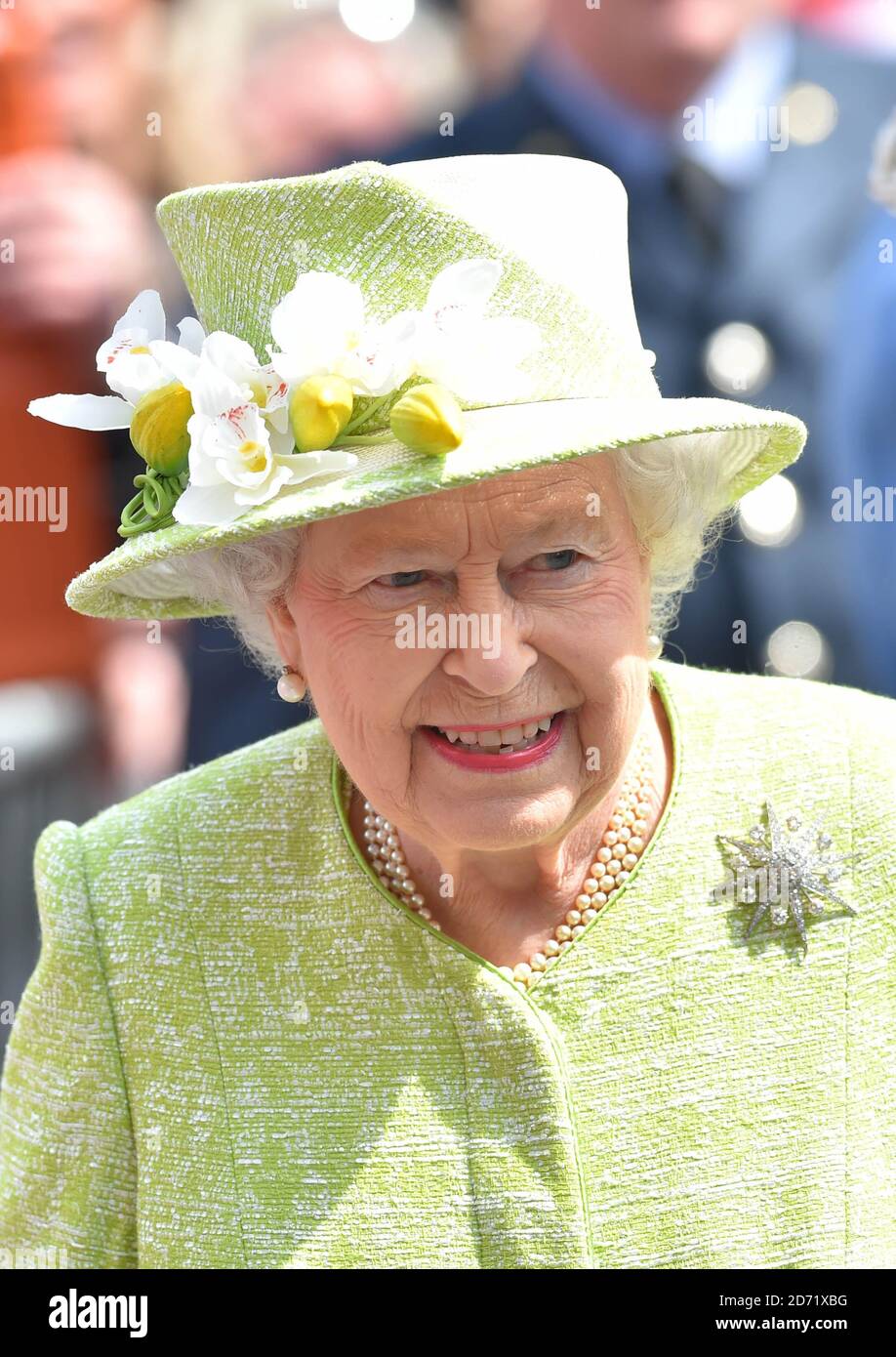 Queen Elizabeth II greets crowds outside Windsor Castle in Berkshire as ...