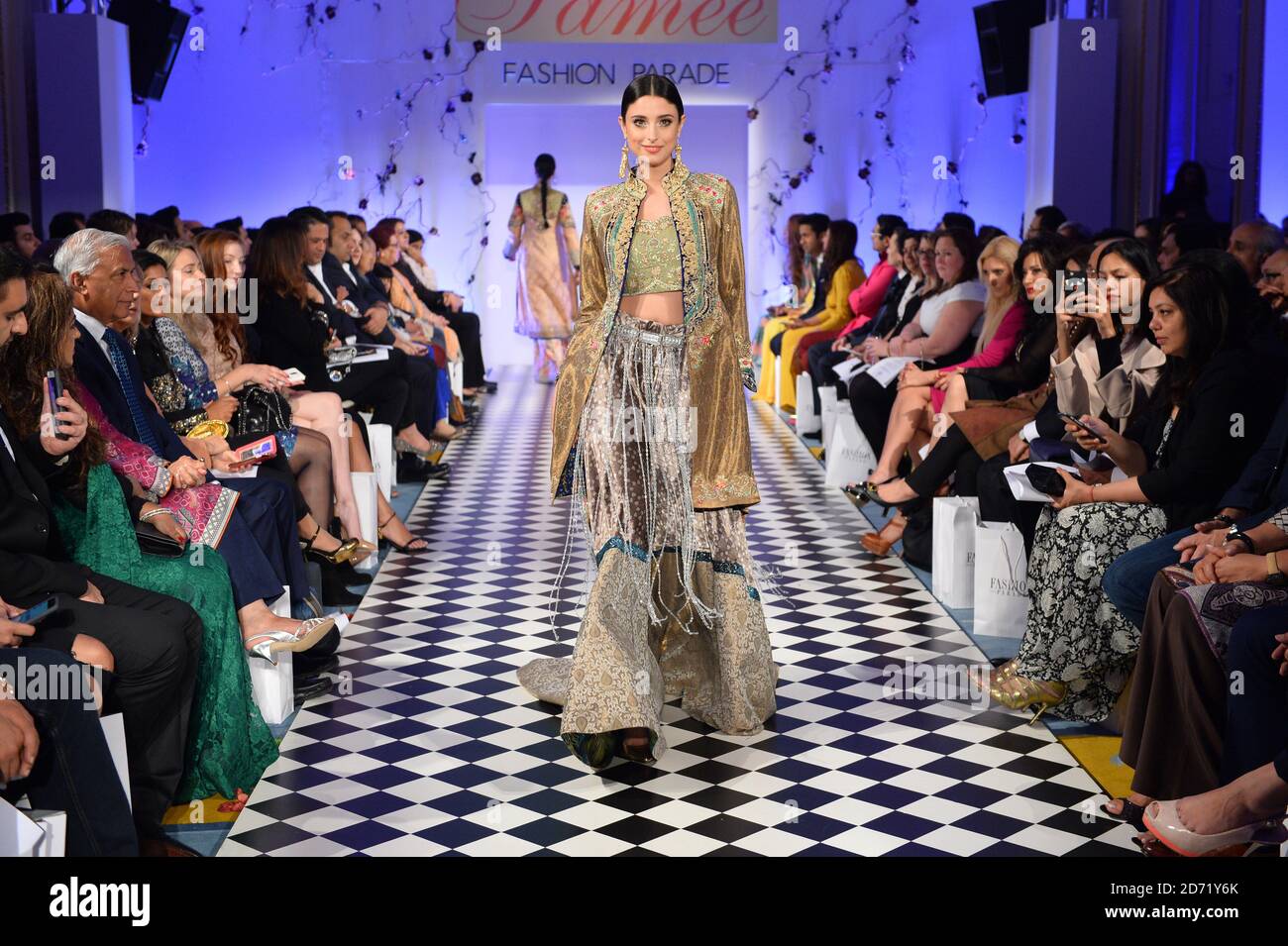 A model wears a design by Faiza Samee at Fashion Parade, showcasing the ...