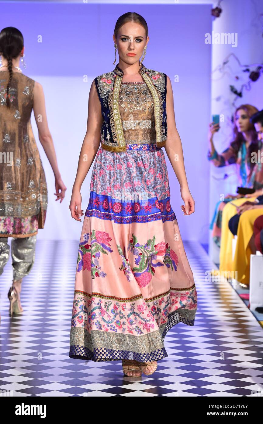 A model wears a design by Faiza Samee at Fashion Parade, showcasing the ...