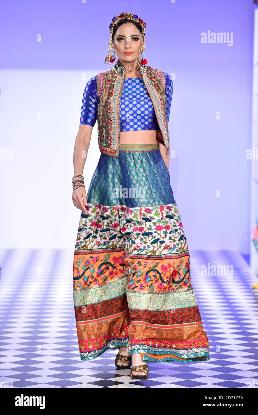 A model wears a design by Faiza Samee at Fashion Parade, showcasing the ...