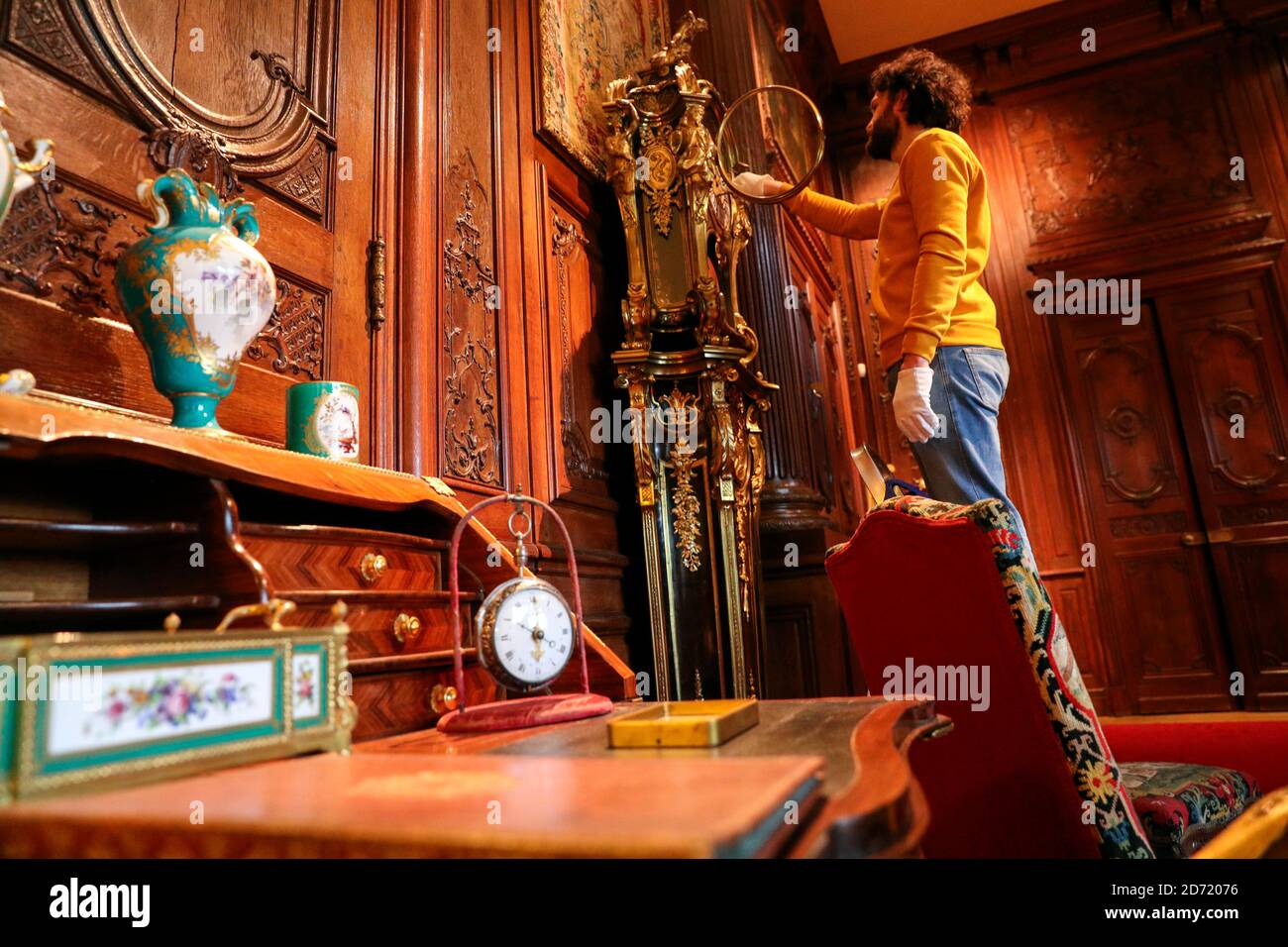 Assistant Head Steward Matthew Waters checks a clock at Waddesdon Manor ...