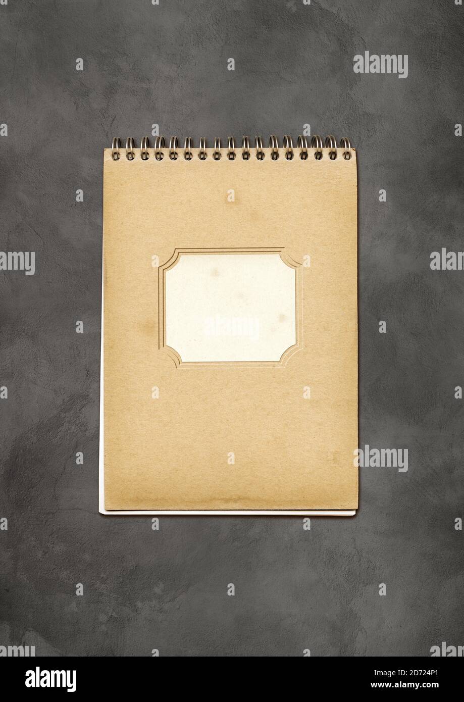 Vintage spiral close notebook, brown paper cover, isolated on concrete ...