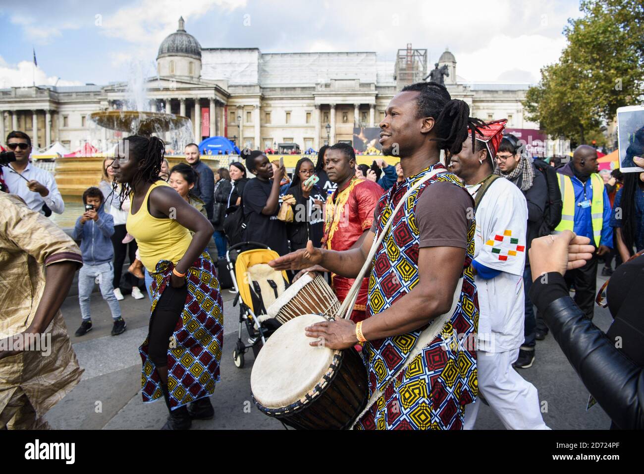 Dancers in a procession during Africa on the Square, an event ...