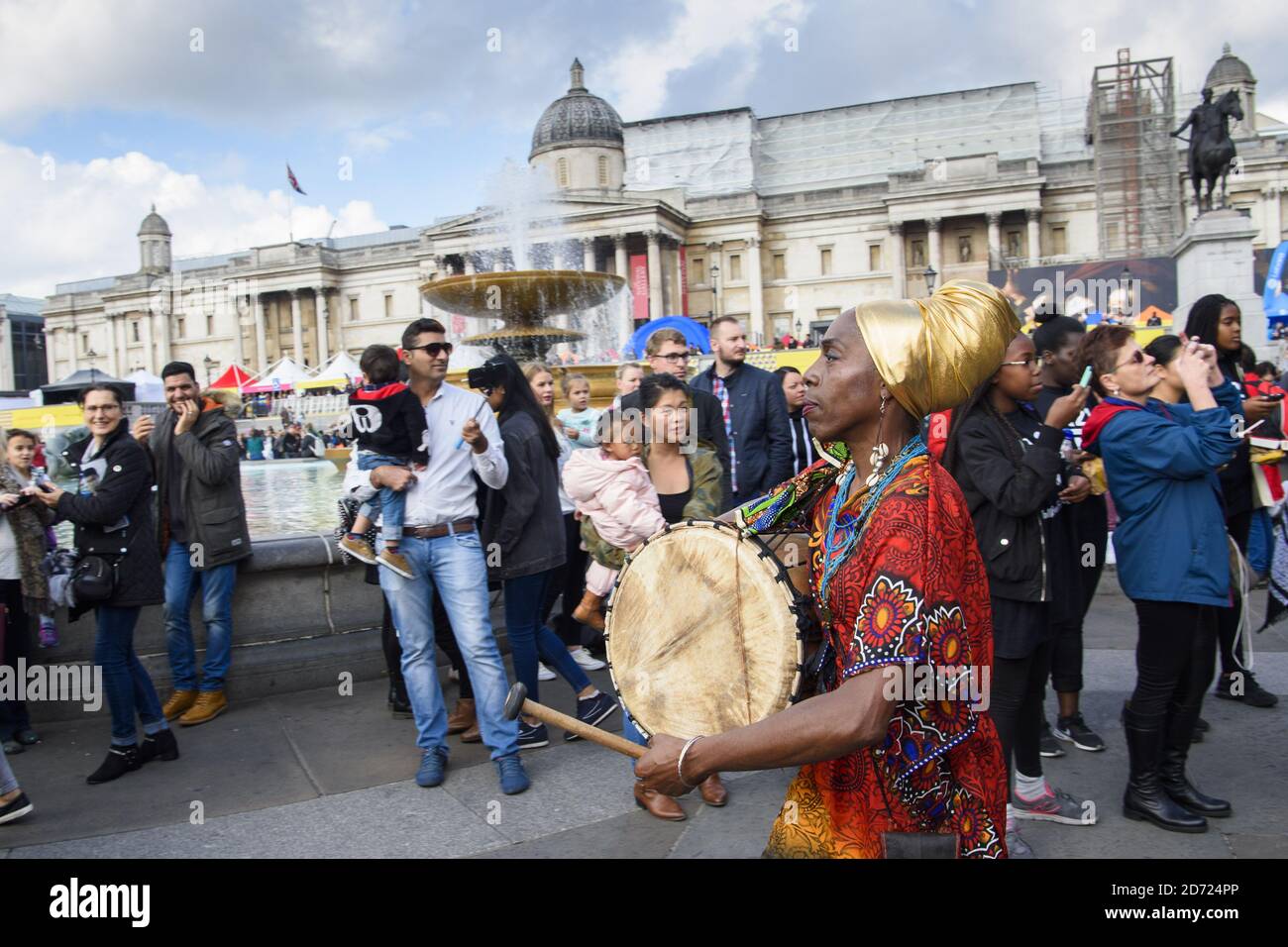 Dancers in a procession during Africa on the Square, an event ...