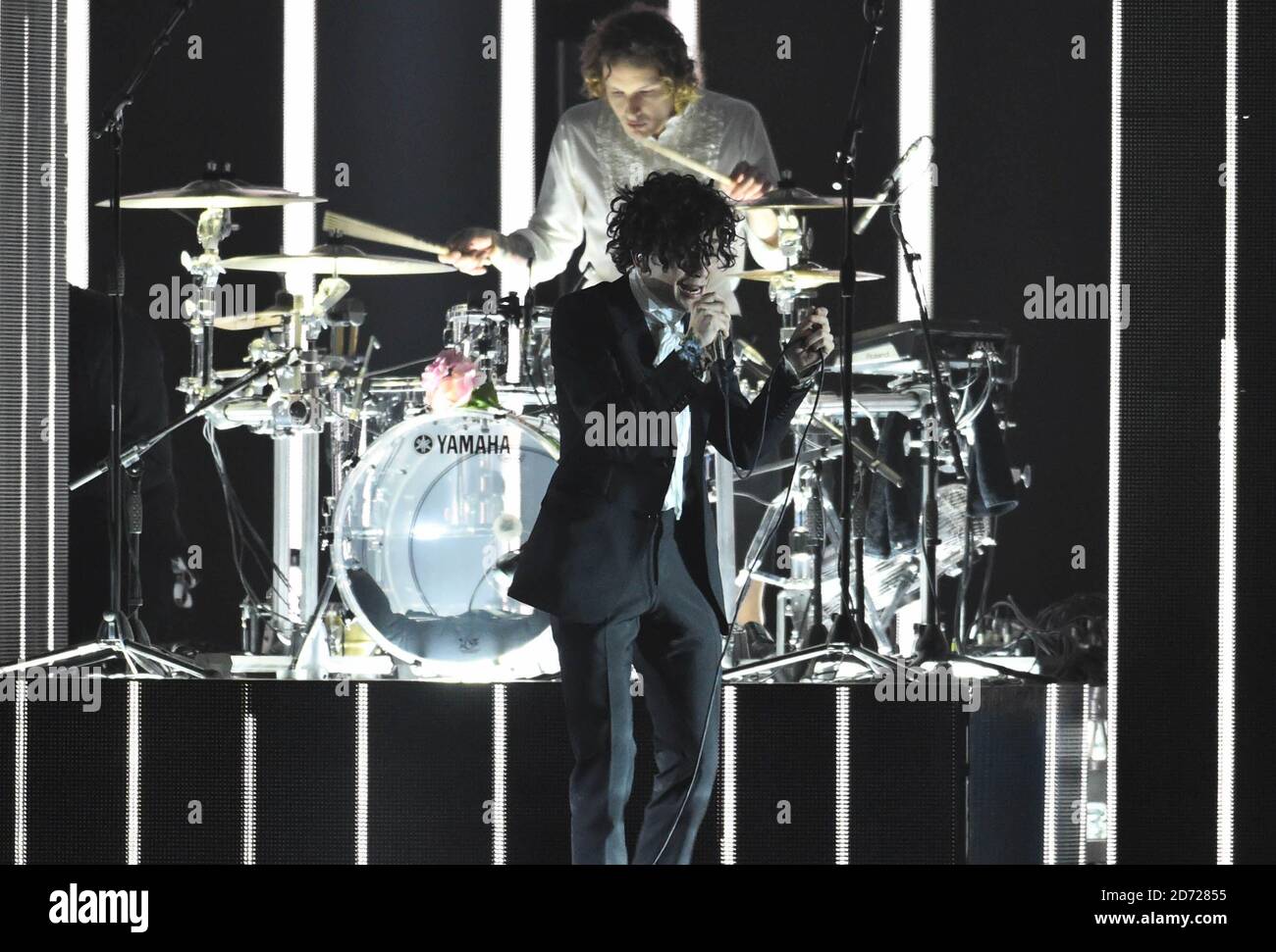 The 1975 on stage at the BRIT Awards 2017, held at The O2 Arena, in ...