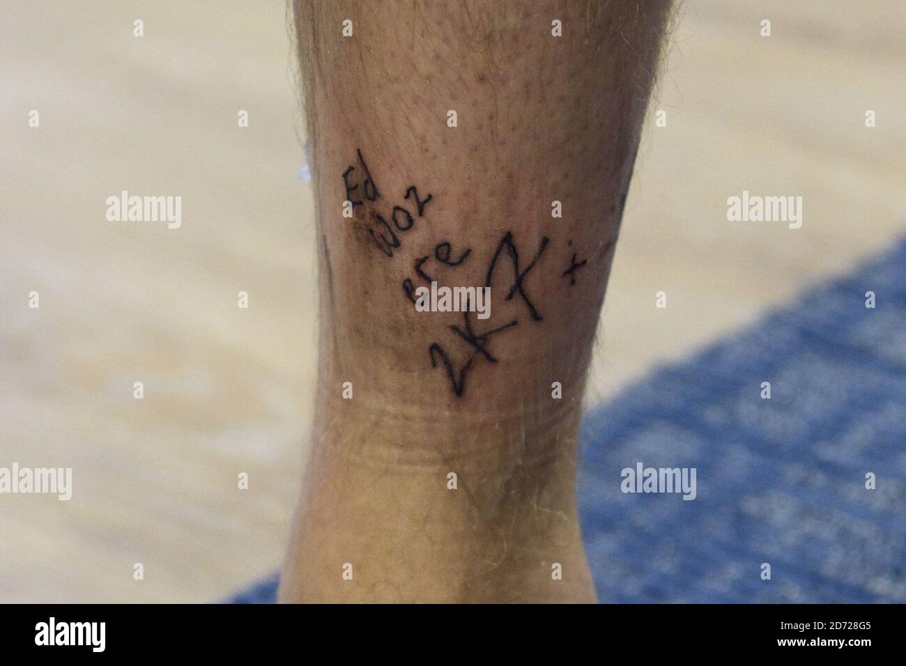 Ed Sheeran gives a tattoo to presenter Roman Kemp, during the Capital ...