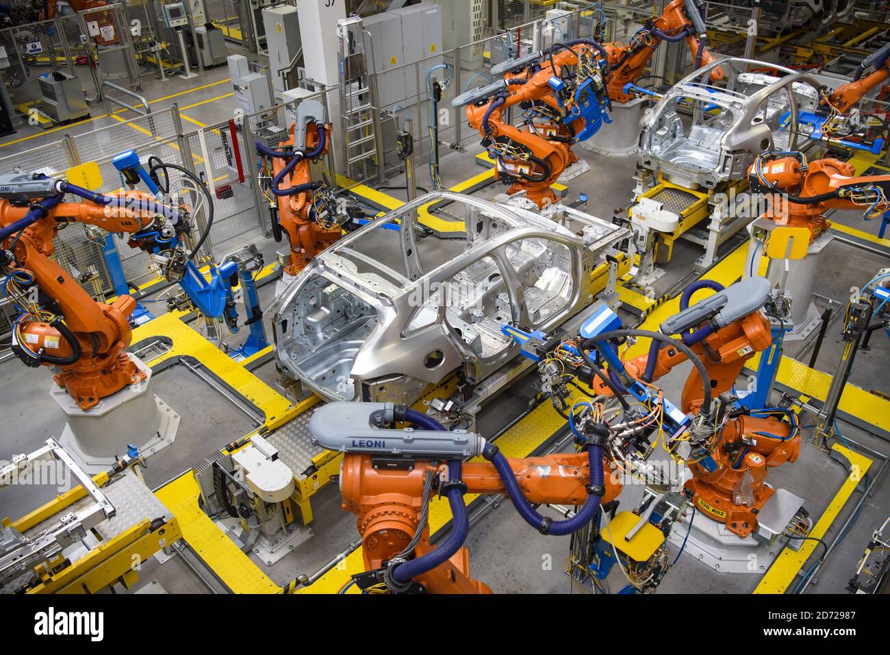 Robotic arms rivet car panels together in the Aluminium Body Shop, part ...