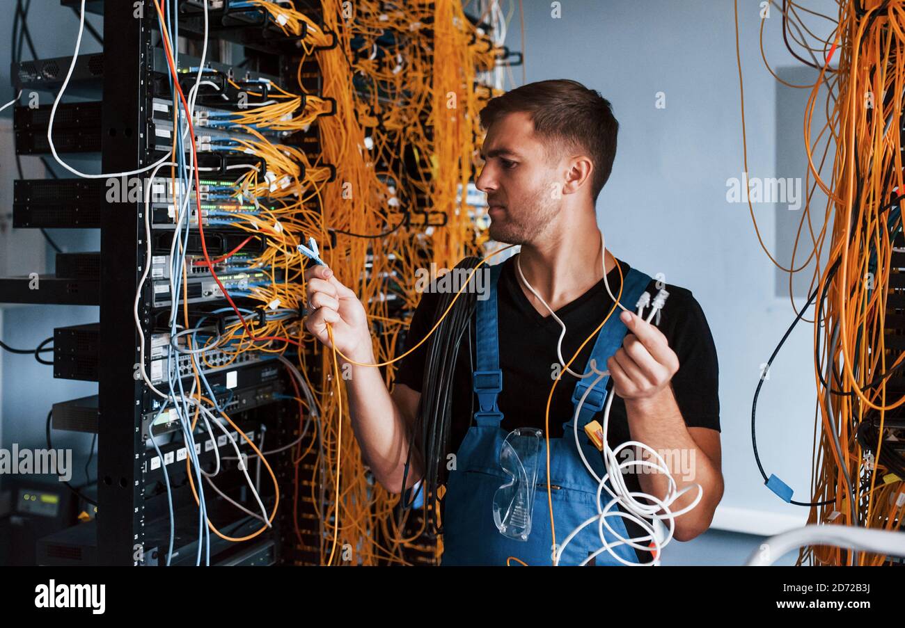 Young man in uniform feels confused and looking for a solution with ...