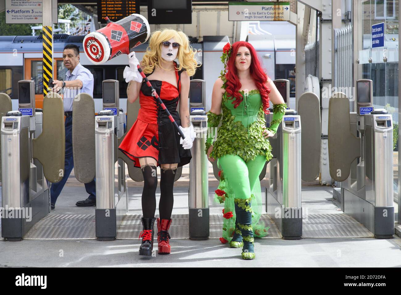 Cosplay fans in costume pictured arriving at Olympia tube station ...